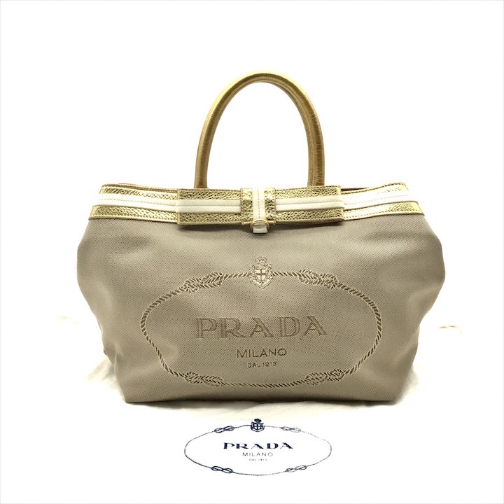 【楽天市場】【中古】良品 PRADA プラダ 三角ロゴ プレート リボン モチーフ ハンド バッグ ベージュ ゴールド キャンバス レディース a4026：BEGINSELL