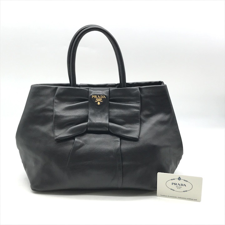【楽天市場】【中古】良品 PRADA プラダ ロゴ金具 リボンモチーフ レザー ハンド トート バッグ ブラック レディース a6862：BEGINSELL