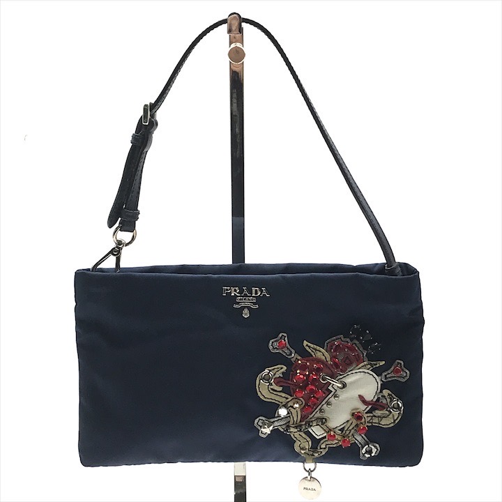【楽天市場】【中古】良品 PRADA プラダ 三角ロゴ ハートモチーフ ストーン チャーム ナイロン テスート ハンド バッグ ポーチ ネイビー k2156：BEGINSELL
